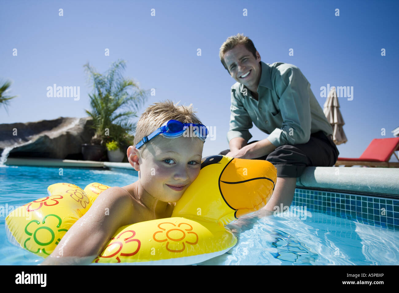 Father and son at swimming pool Stock Photo - Alamy