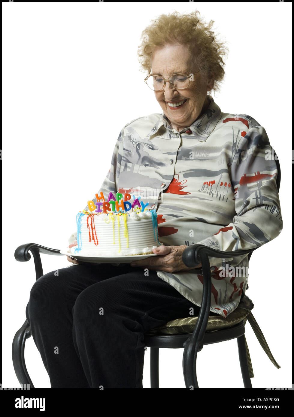 Elderly woman on her birthday with cake Stock Photo - Alamy