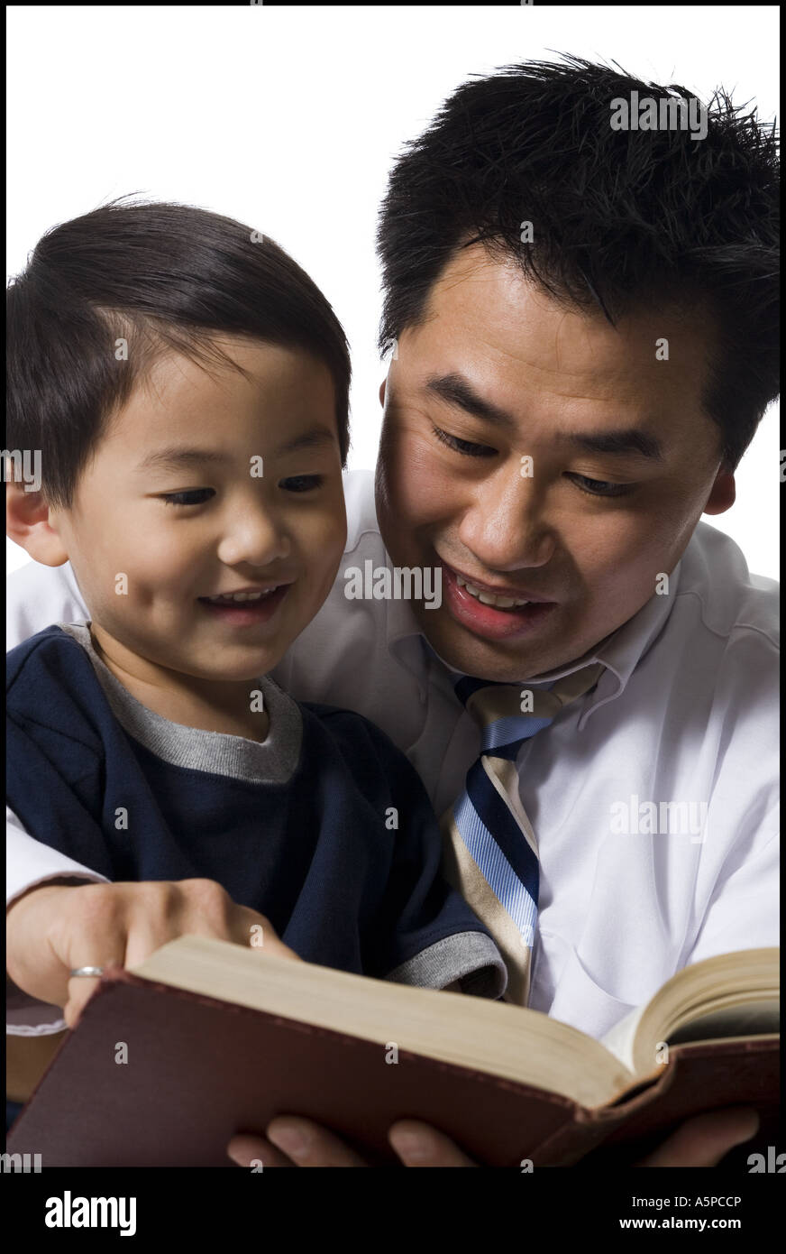 Father reading story to son Stock Photo - Alamy