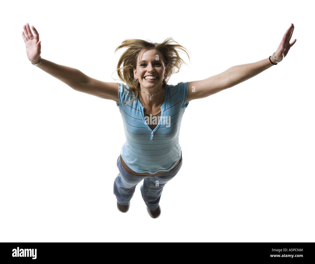Smiling woman flying Stock Photo - Alamy