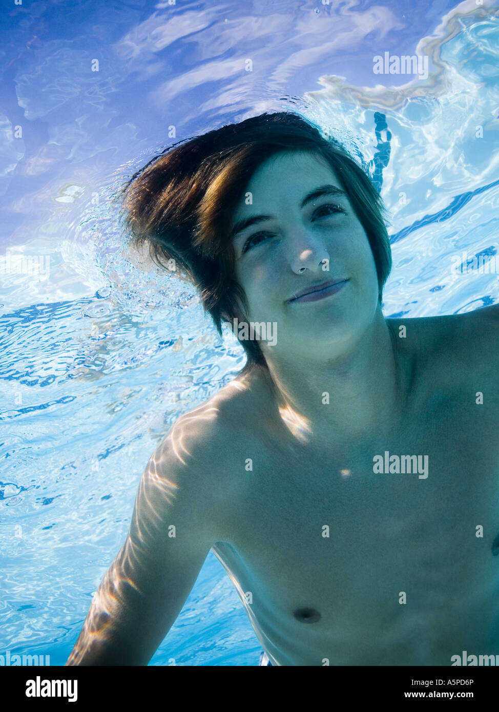 Boy swimming underwater in pool Stock Photo - Alamy