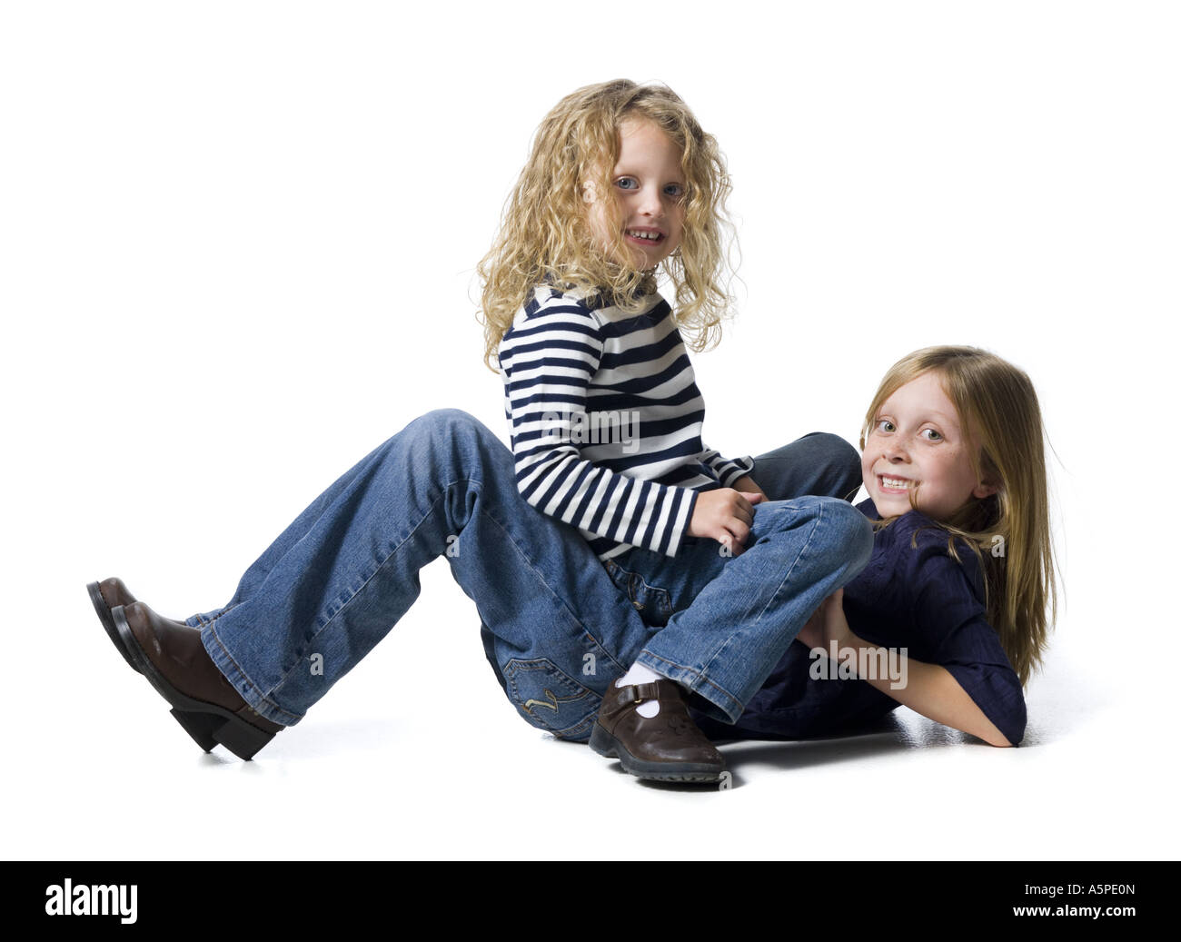 Two girls playing together Stock Photo - Alamy