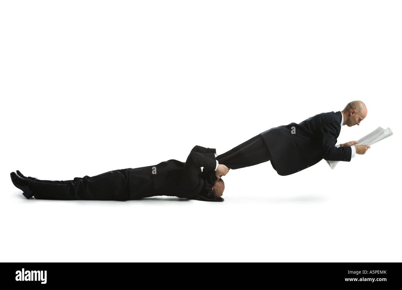 Profile of two male acrobats in business suits Stock Photo - Alamy