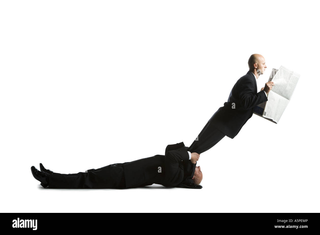Profile of two male acrobats in business suits Stock Photo - Alamy