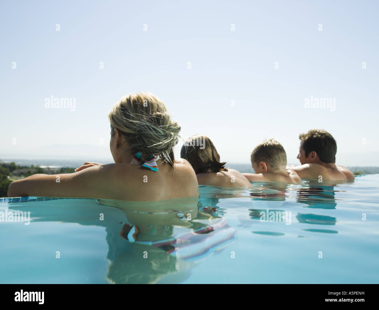 Children swimming in an infinity pool hi-res stock photography and ...