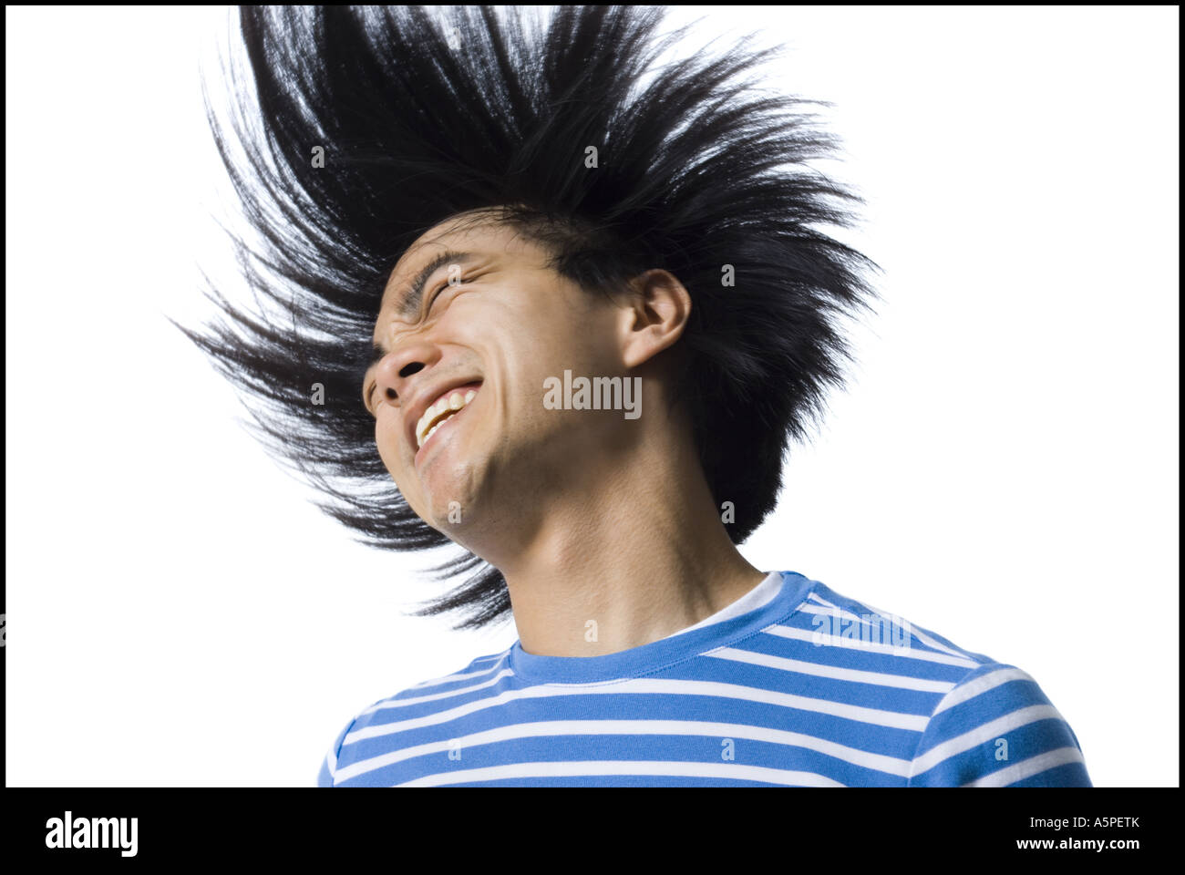 Laughing man with wild hair Stock Photo - Alamy