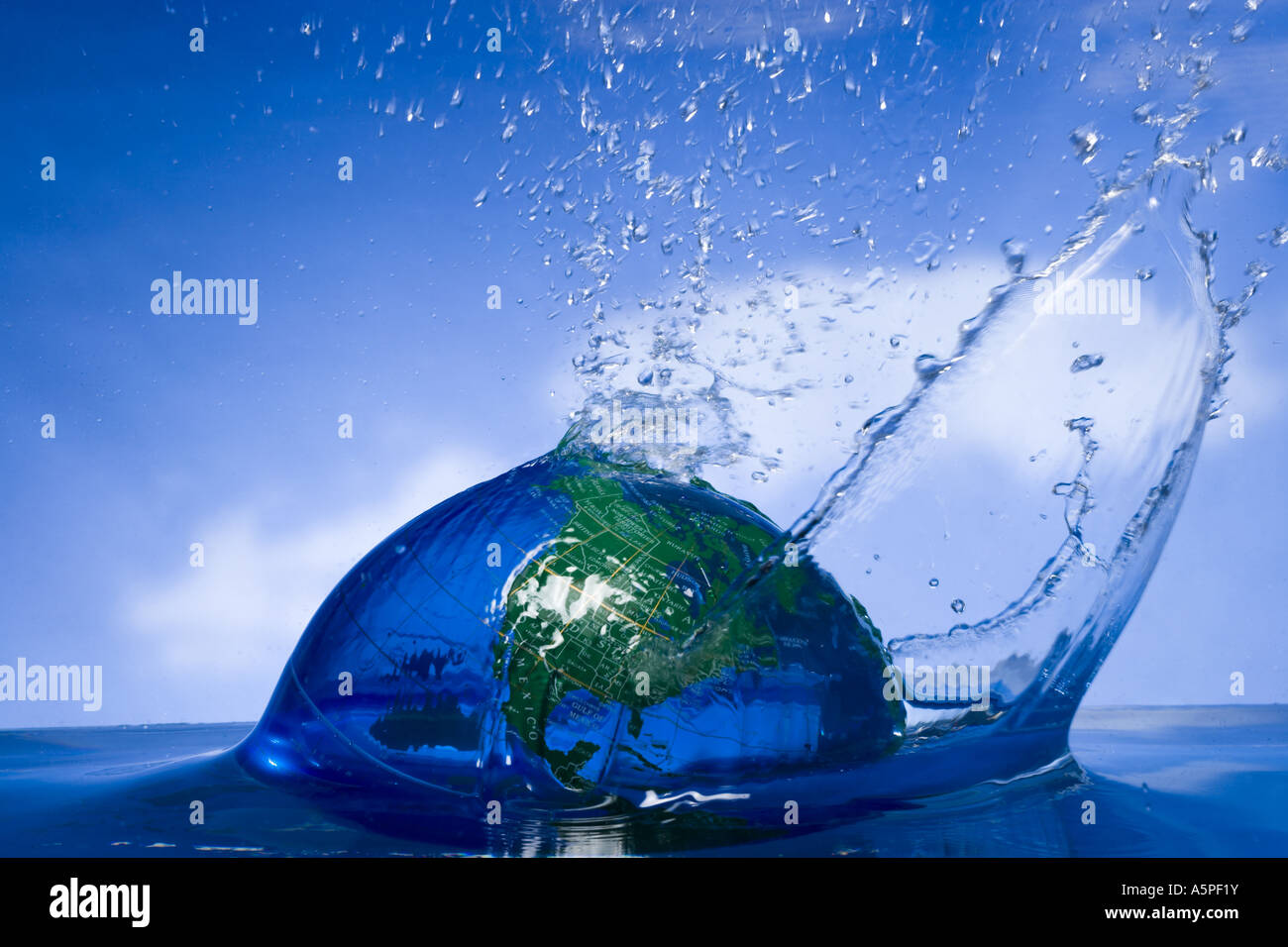 Earth globe floating in water Stock Photo - Alamy