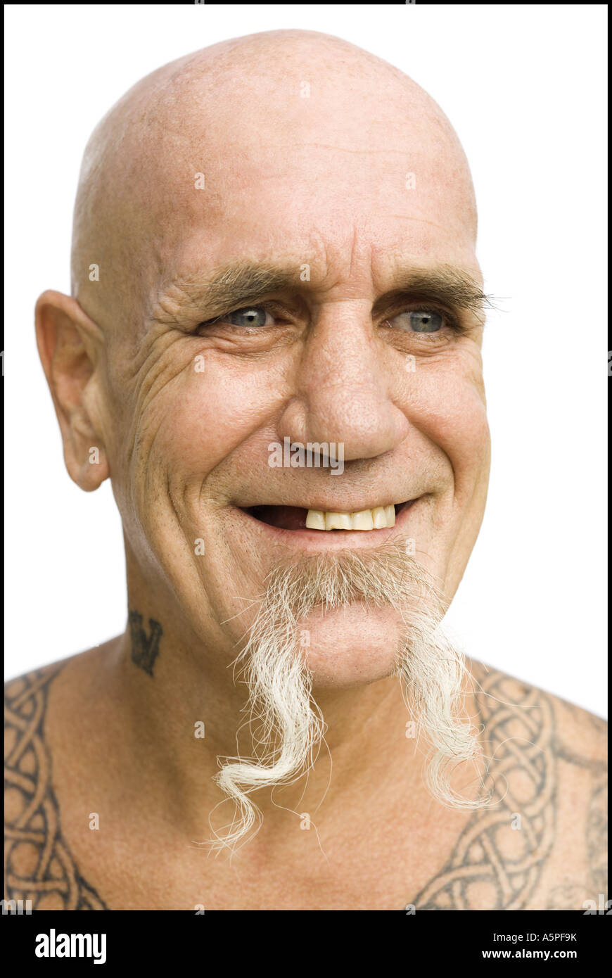 Heavily tattooed man smiling Stock Photo - Alamy