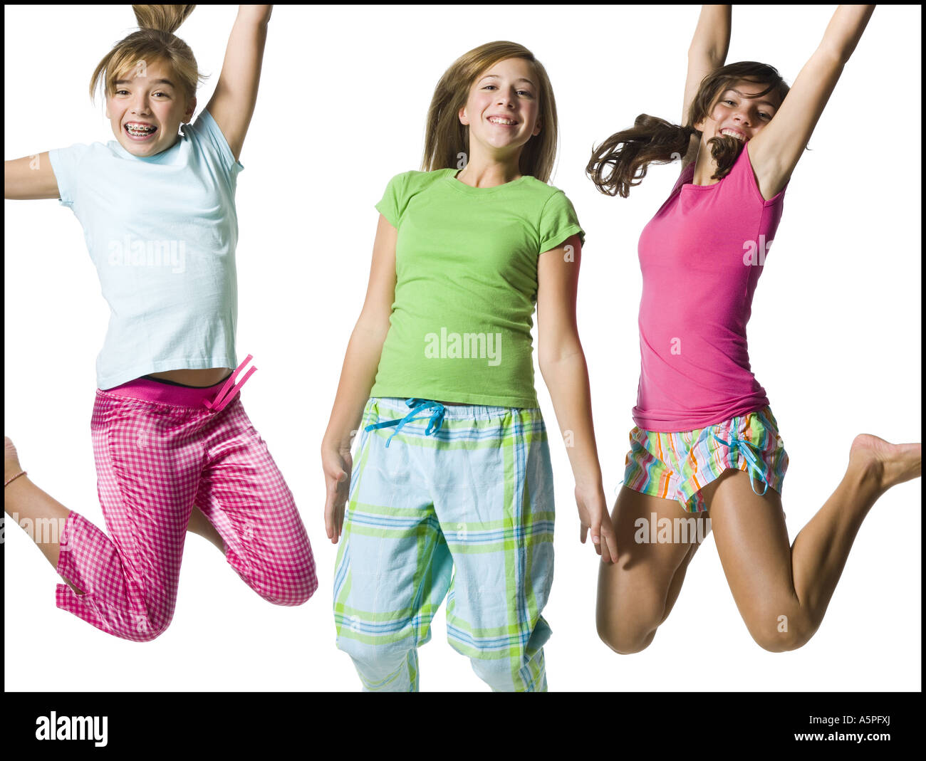 Three girls jumping Stock Photo - Alamy