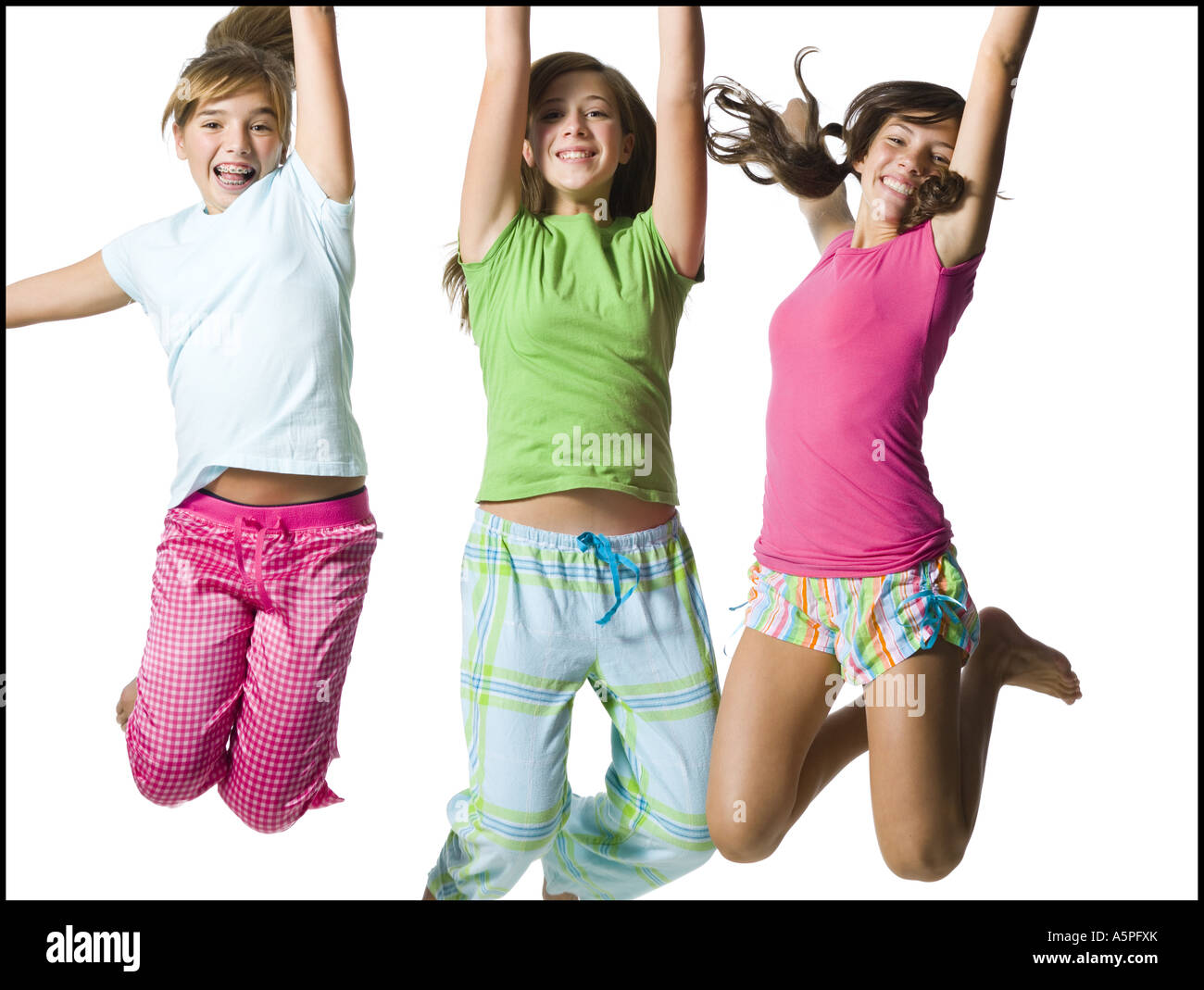 Three girls jumping Stock Photo - Alamy