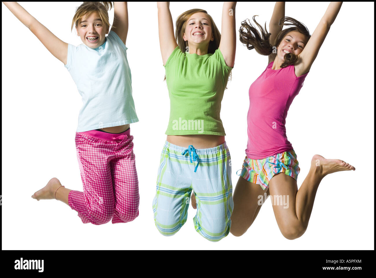 Three girls jumping Stock Photo - Alamy