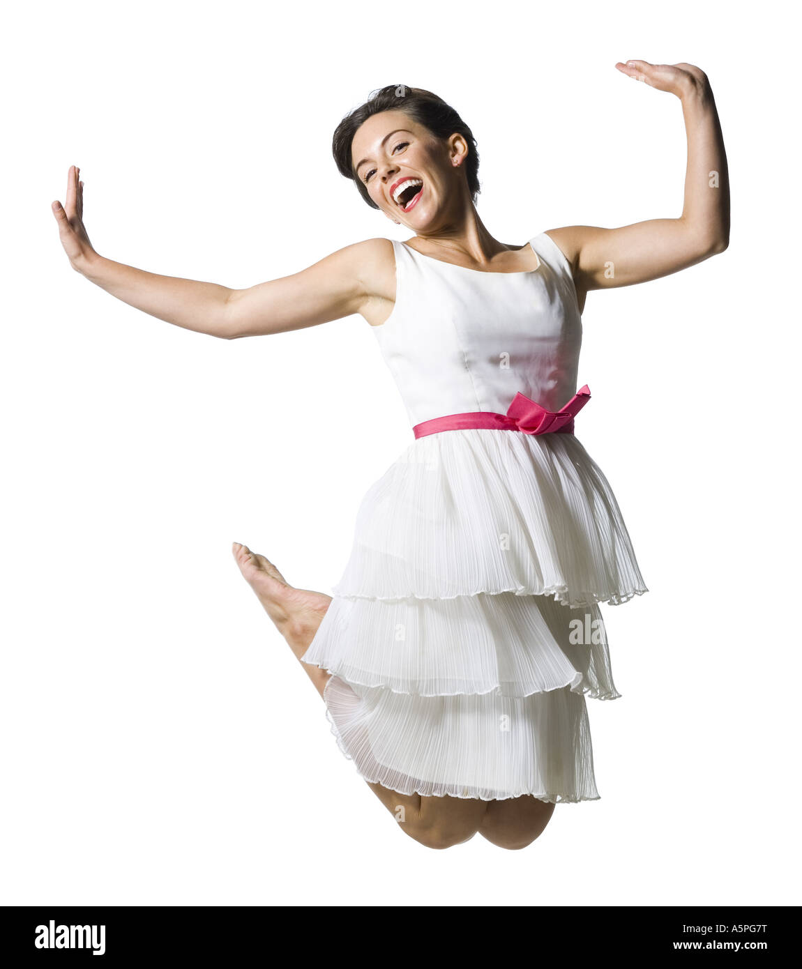 Woman in white dress jumping Stock Photo - Alamy