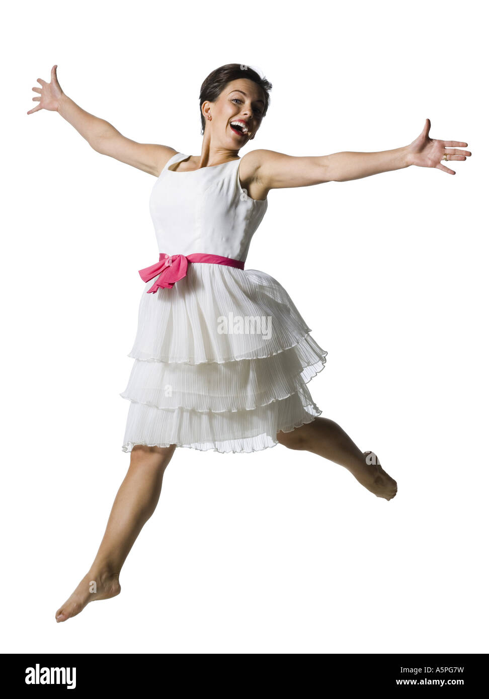 Woman in white dress jumping Stock Photo - Alamy