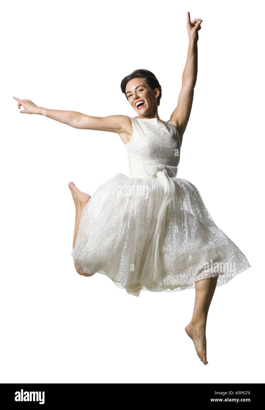 Woman in white dress jumping Stock Photo - Alamy