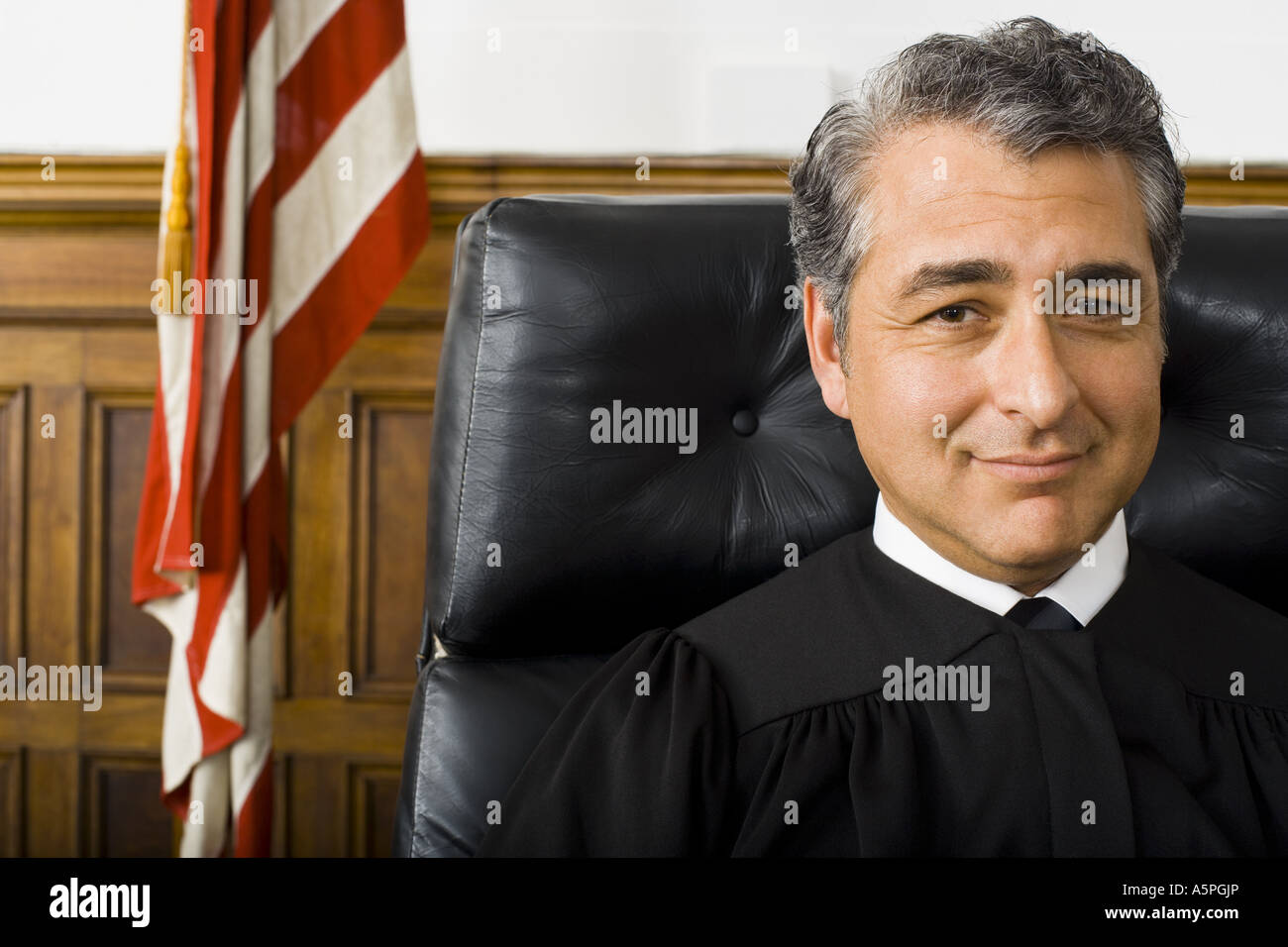 Portrait of a male judge smiling Stock Photo - Alamy