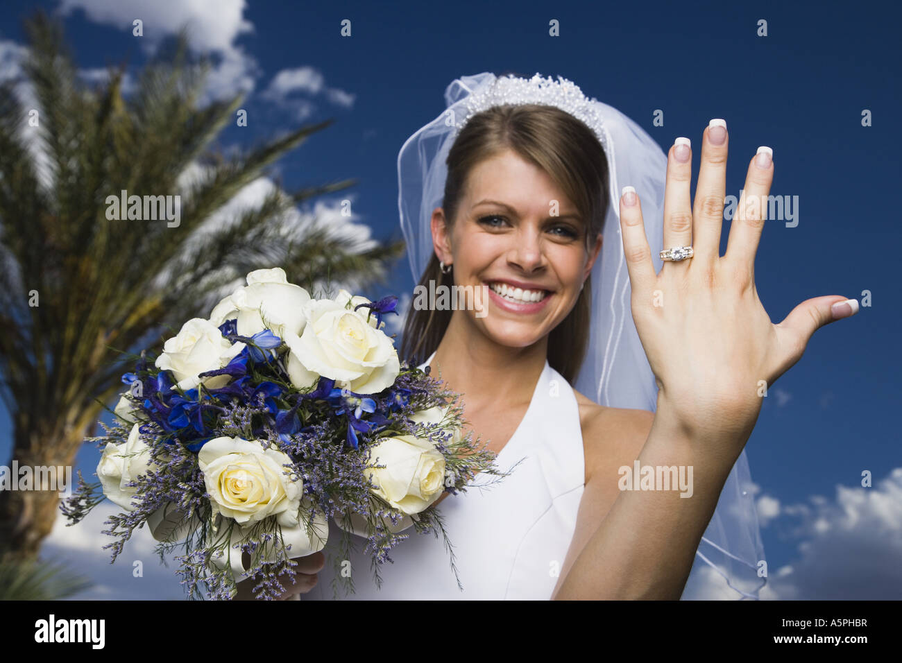 Portrait of a bride showing her wedding ring and smiling Stock Photo ...