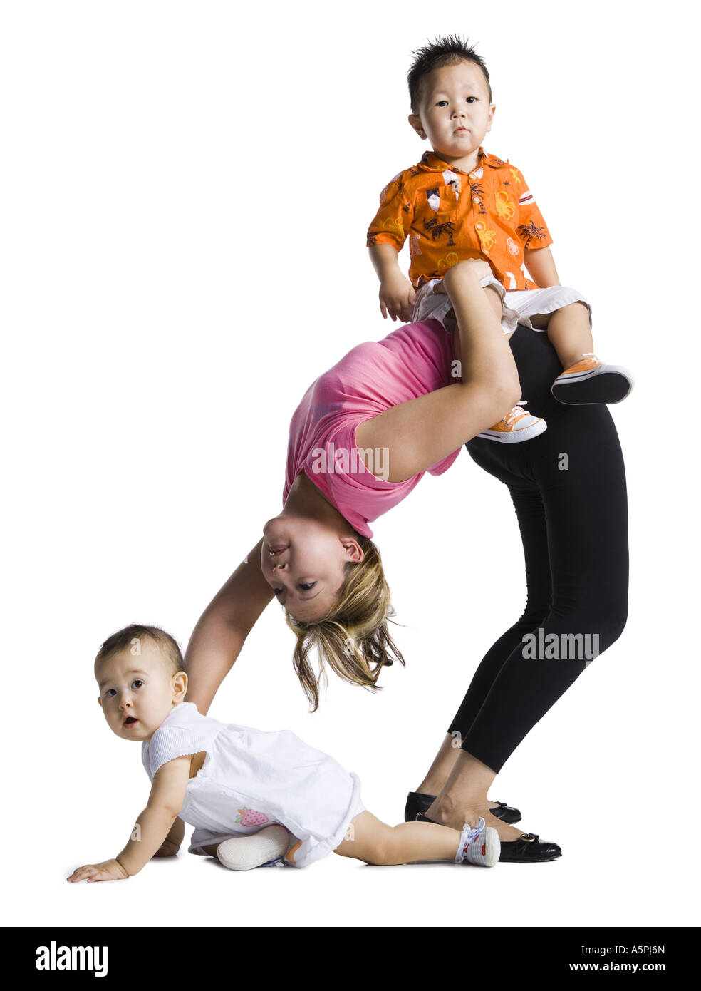 Contortionist mother with son and baby daughter Stock Photo - Alamy