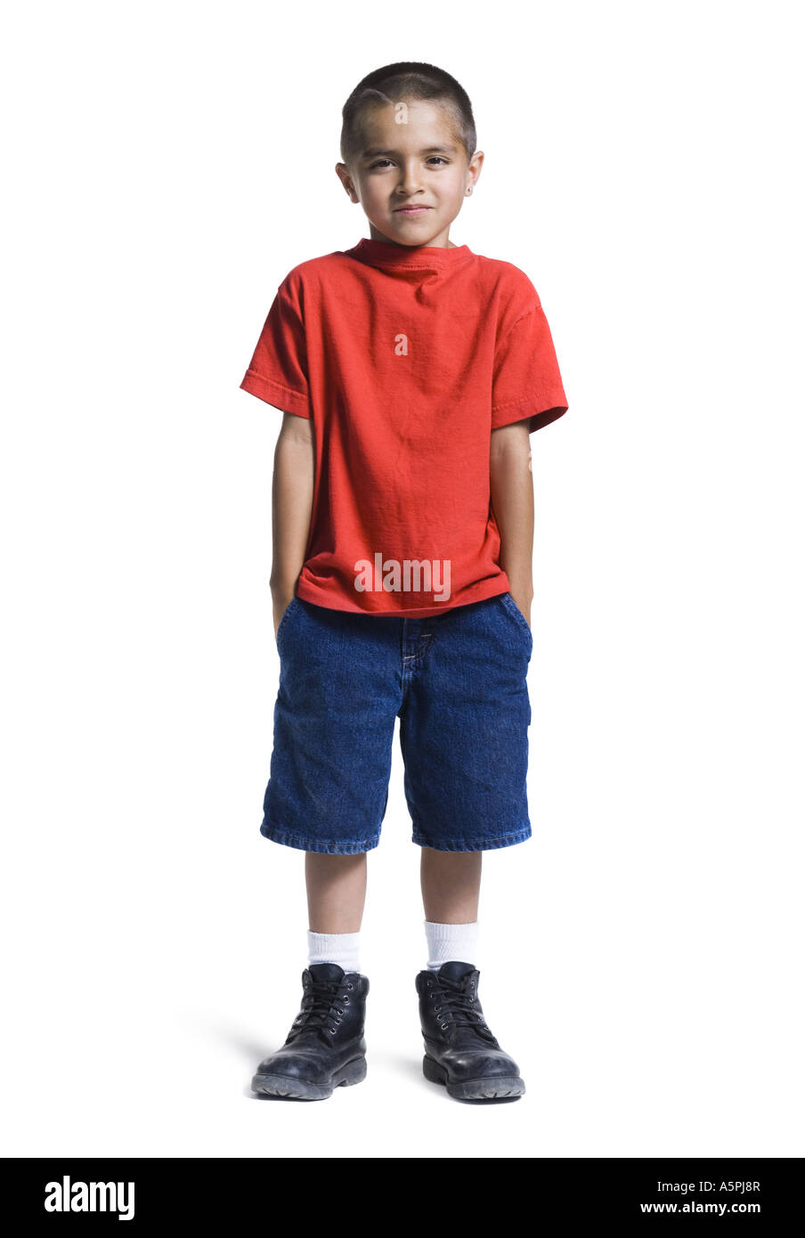 Young boy with hands in pockets Stock Photo - Alamy