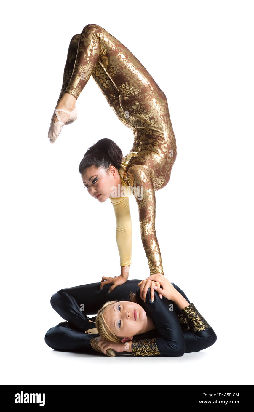 Female contortionist duo performing Stock Photo - Alamy