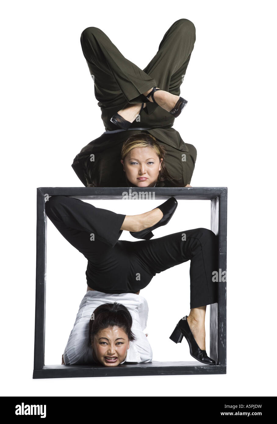 Two female contortionist businesswomen hi-res stock photography and ...