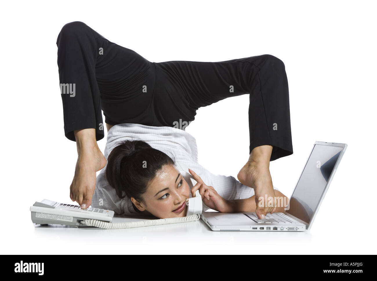 Female contortionist businesswoman Stock Photo - Alamy