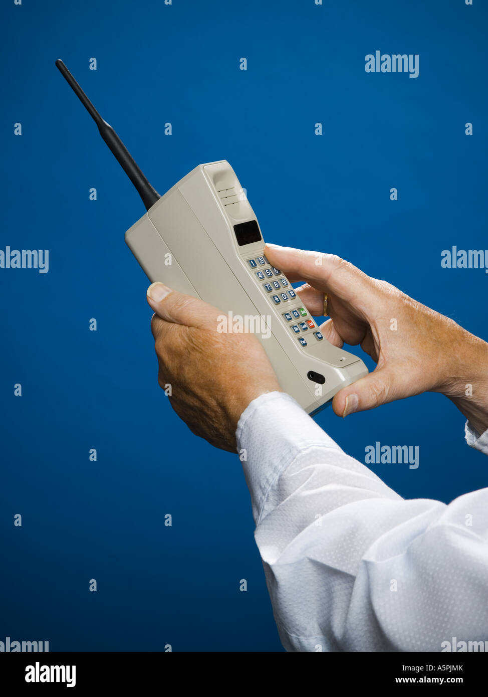 Older man making call on retro wireless phone Stock Photo - Alamy
