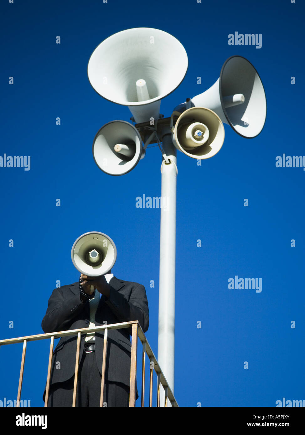 Man yelling through bullhorn Stock Photo - Alamy