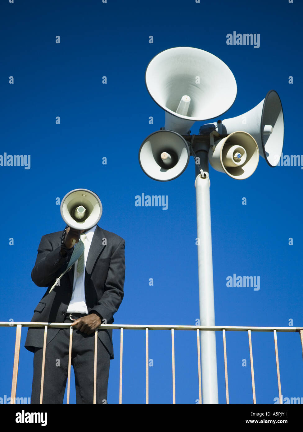 Man yelling through bullhorn hi-res stock photography and images - Alamy