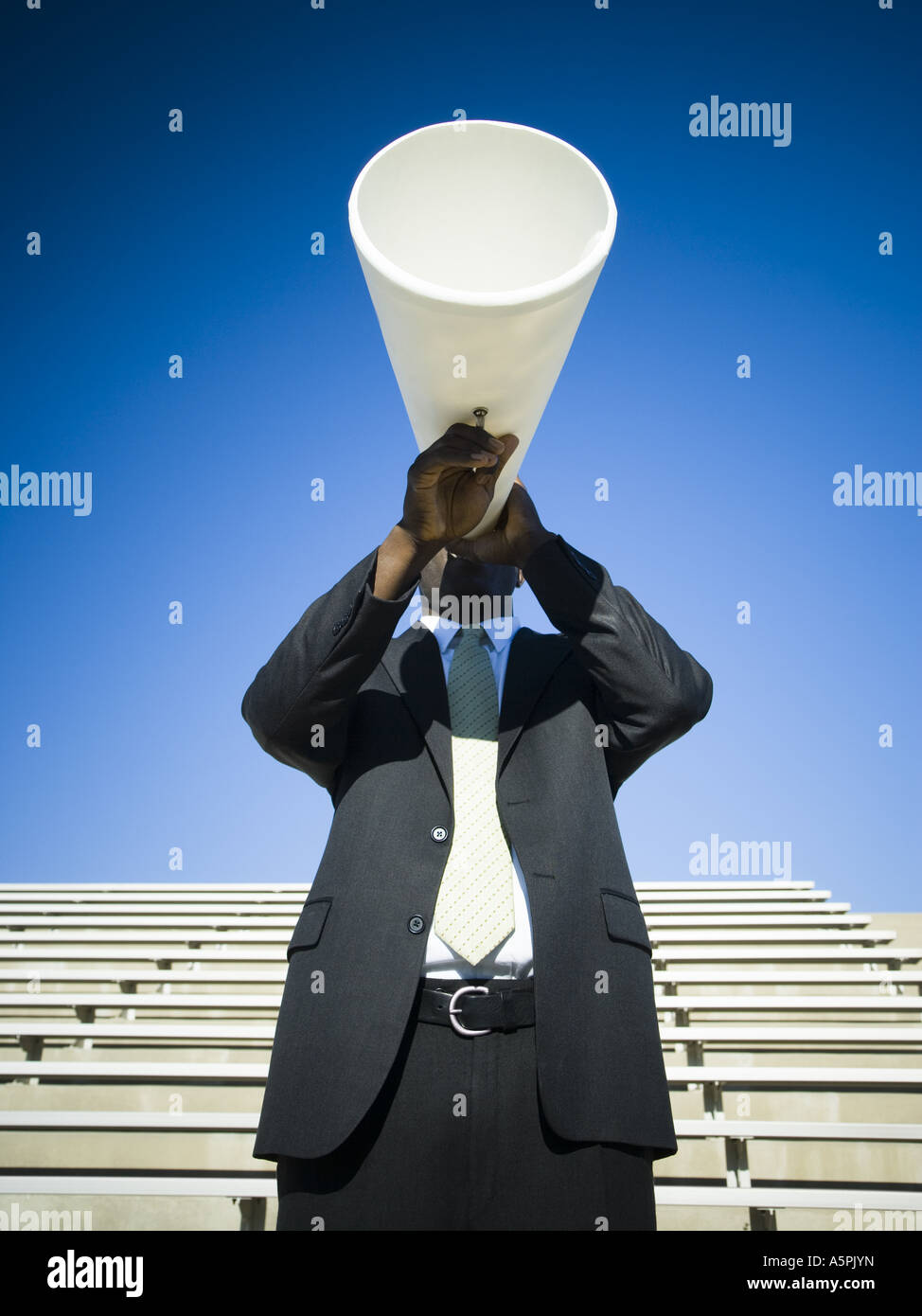 Man yelling through bullhorn Stock Photo - Alamy