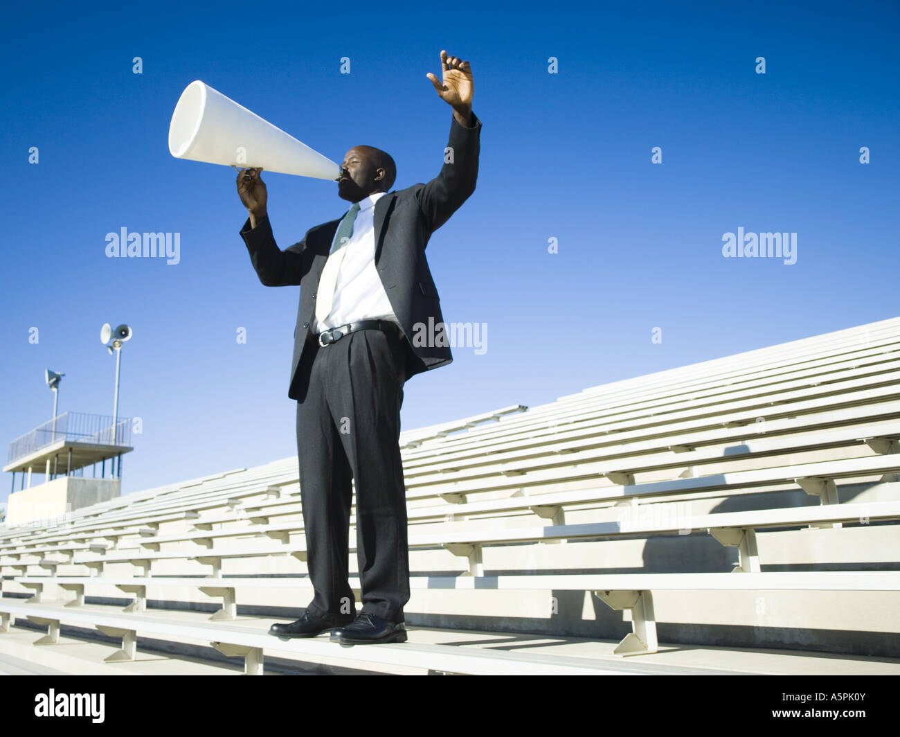 Man yelling through bullhorn Stock Photo - Alamy