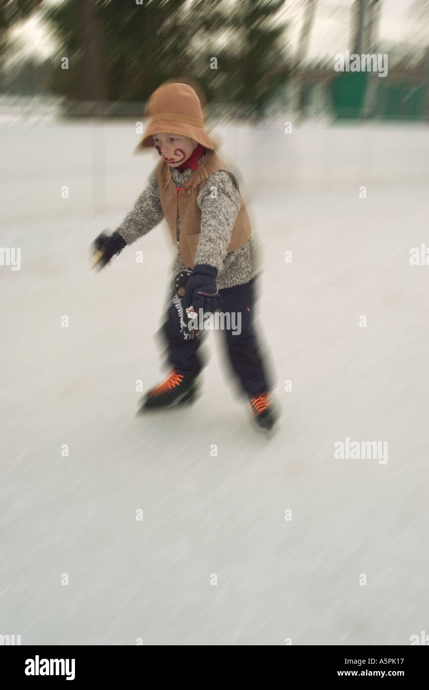 MR Little boy ice skating in costume Stock Photo - Alamy