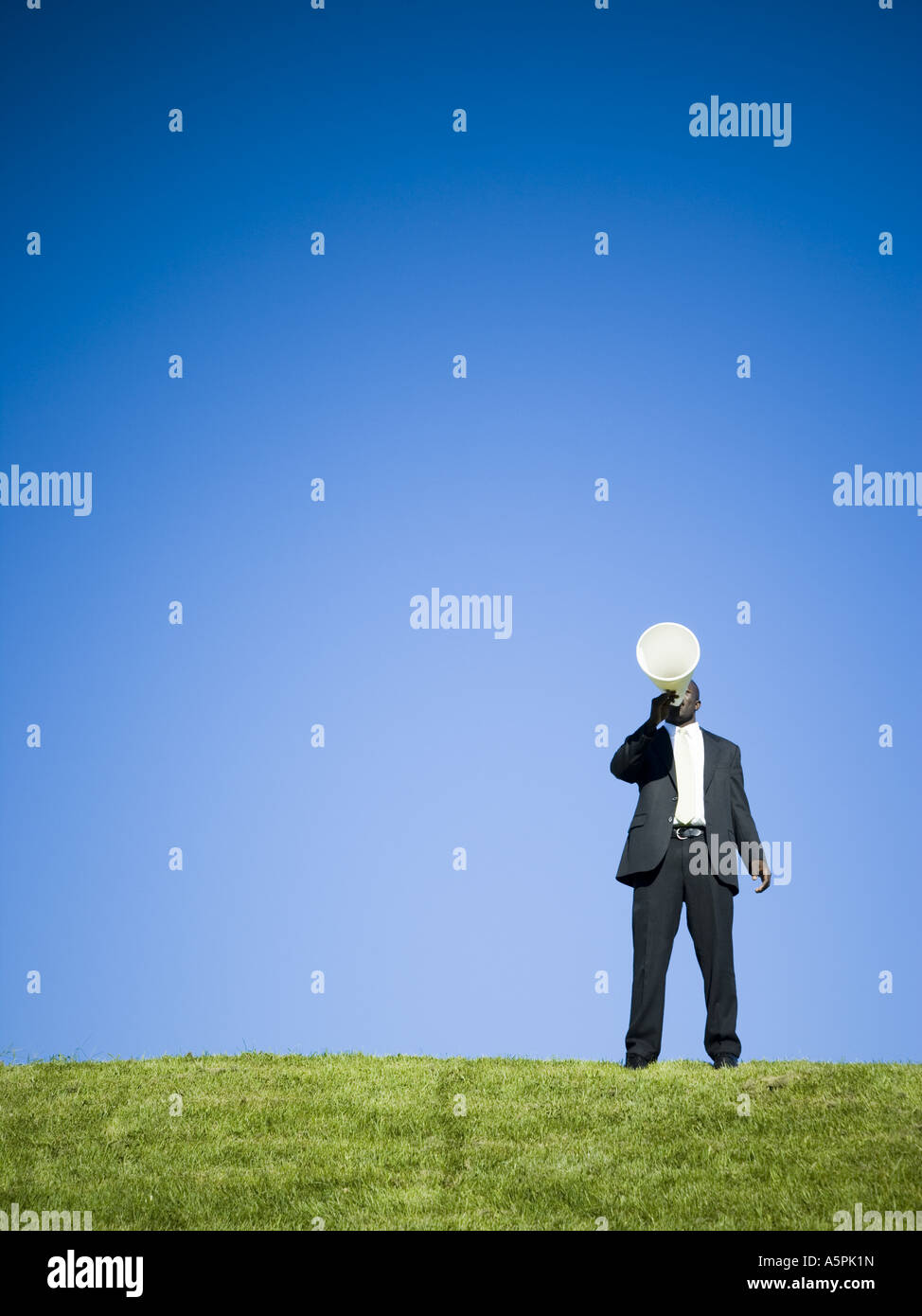 Man yelling through bullhorn Stock Photo - Alamy