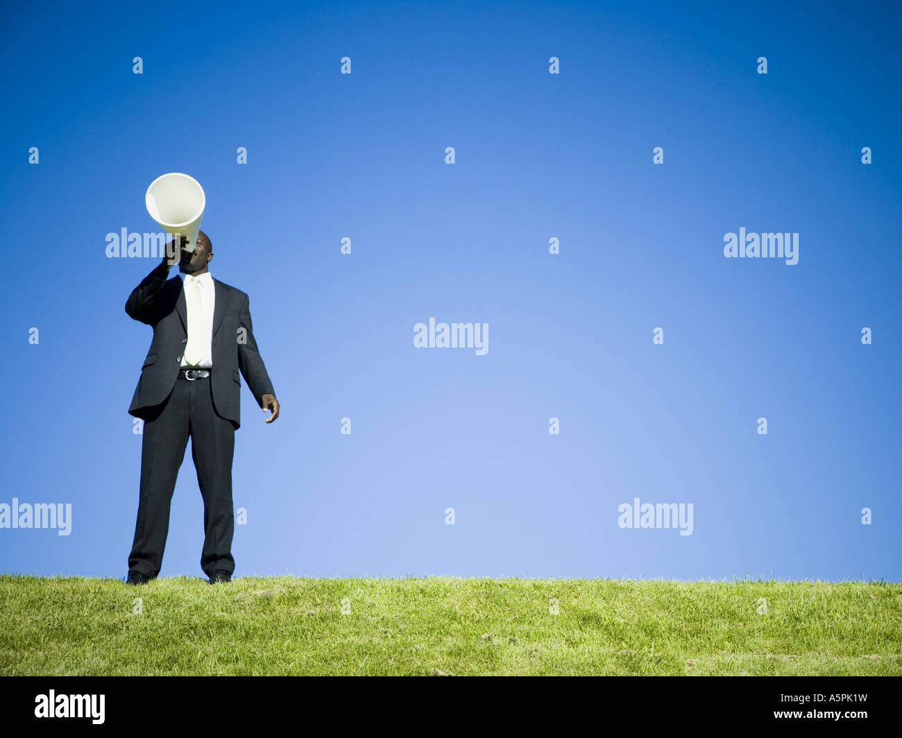 Man yelling through bullhorn Stock Photo - Alamy