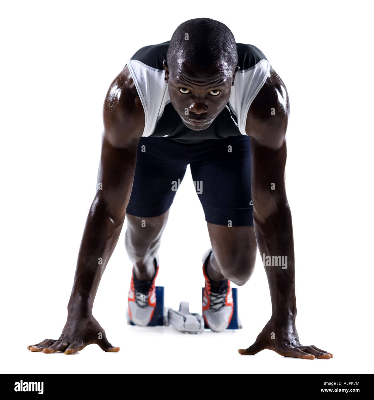 Track runner in starting position ready to race Stock Photo - Alamy