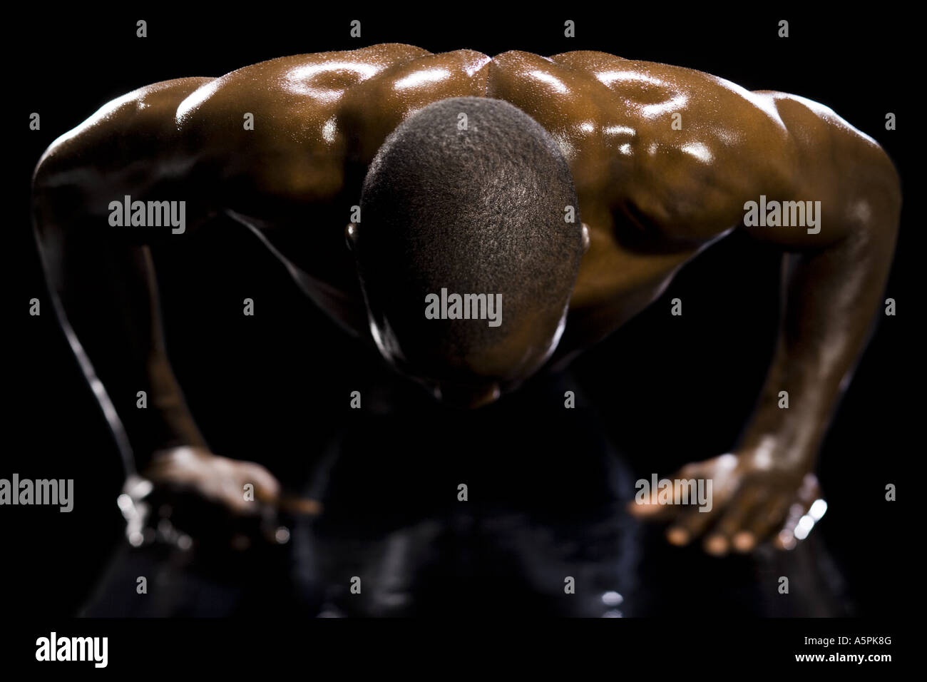 Muscular athlete in dark room hi-res stock photography and images - Alamy
