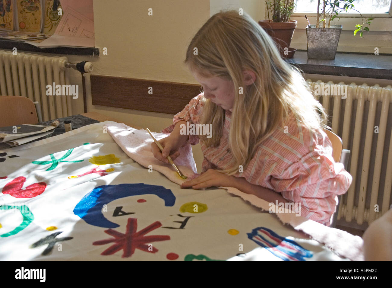 pupils of a 4th class in primary school painting on cloth Stock Photo ...