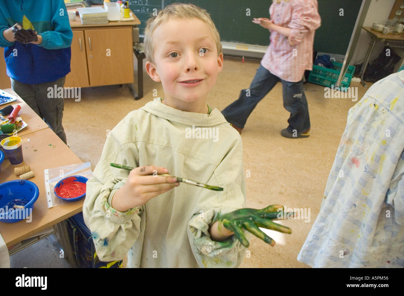 pupils of a 4th class in primary school painting on cloth Stock Photo ...