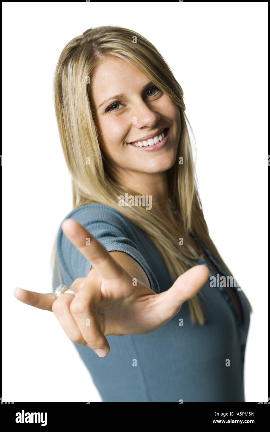 Woman making a hand gesture Stock Photo - Alamy