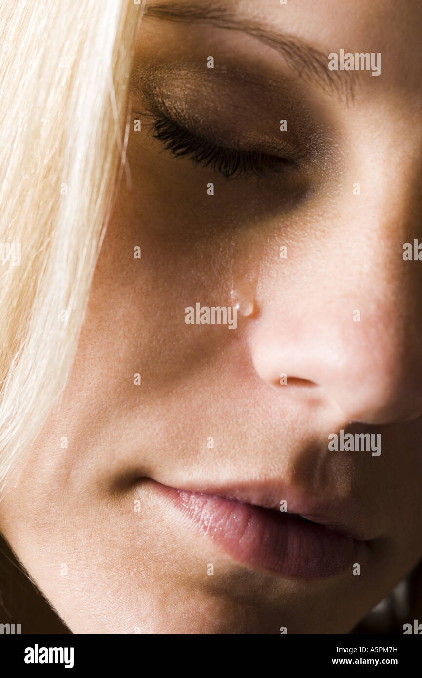 Woman face emotions tear closeup hi-res stock photography and images ...