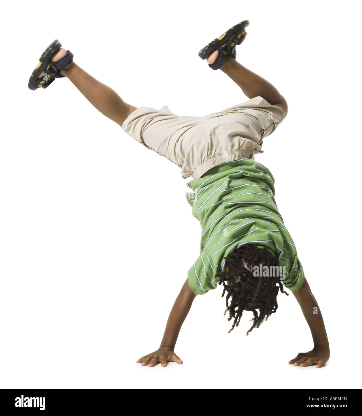 Boy doing a cartwheel Stock Photo - Alamy