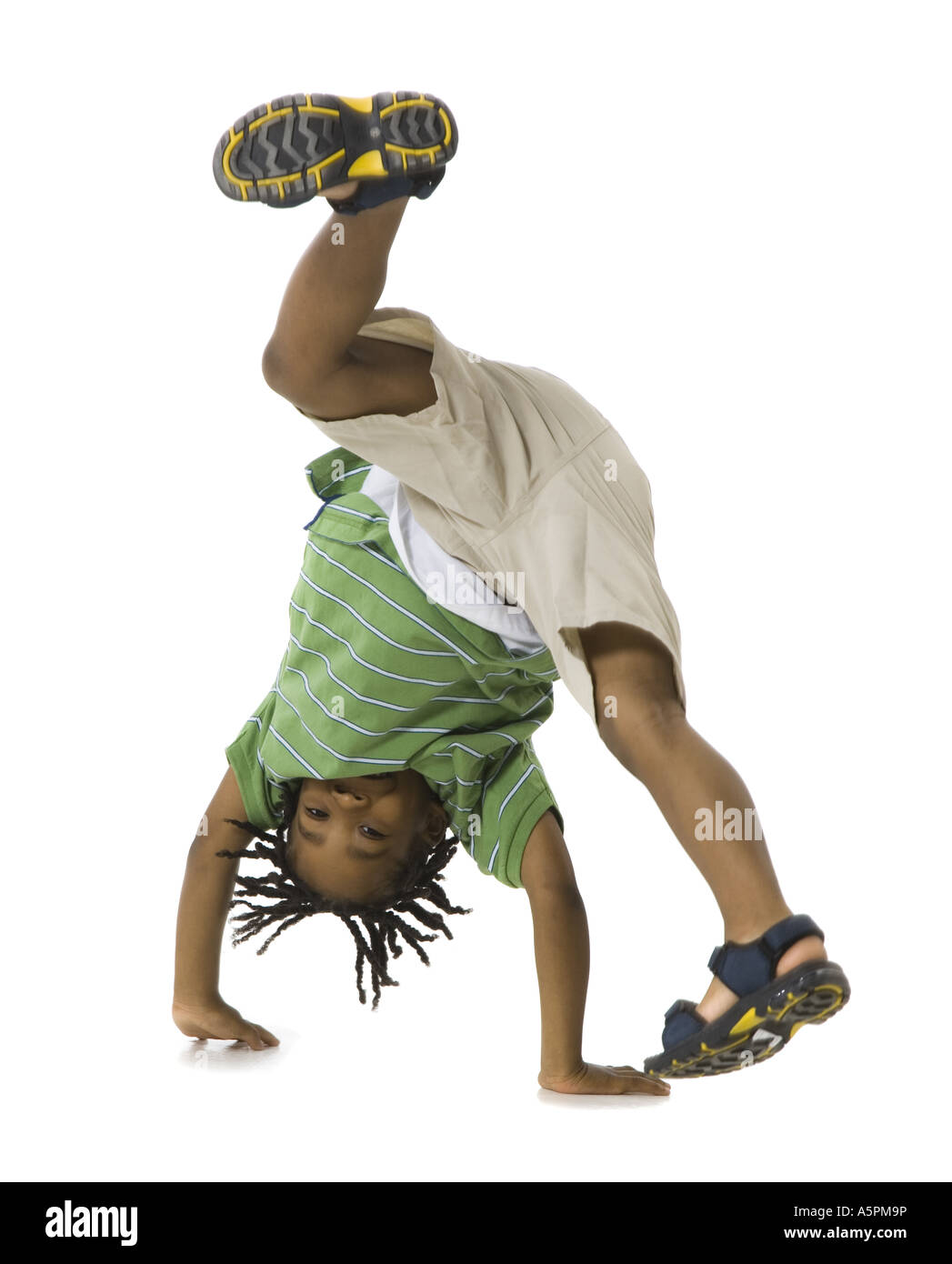 Boy doing a cartwheel Stock Photo - Alamy