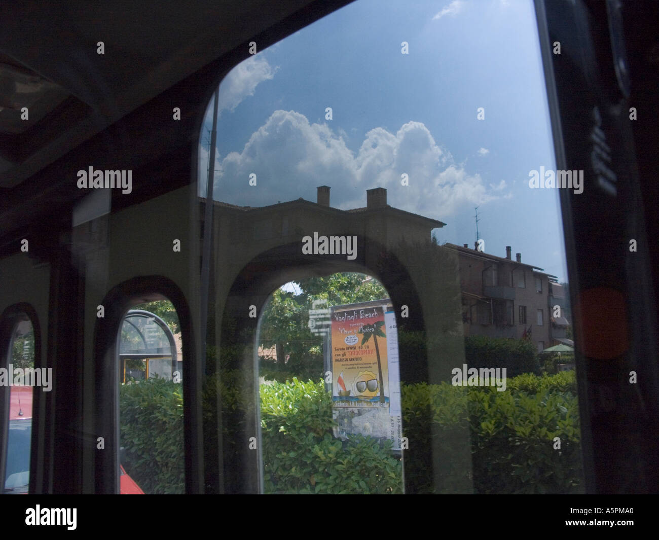 City buildings reflected in bus windows Stock Photo - Alamy