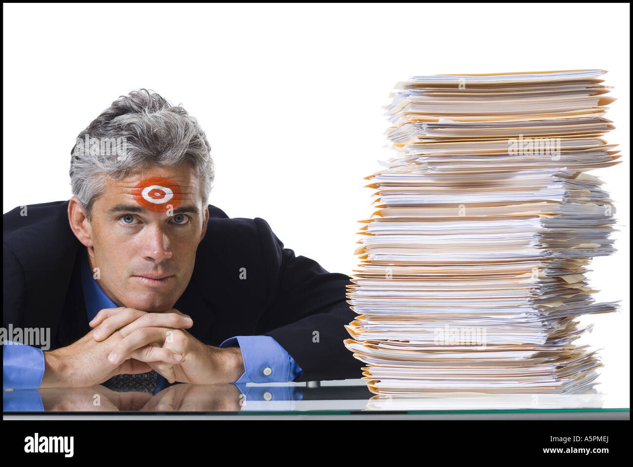 Man with bull s eye on forehead with stack of papers Stock Photo - Alamy