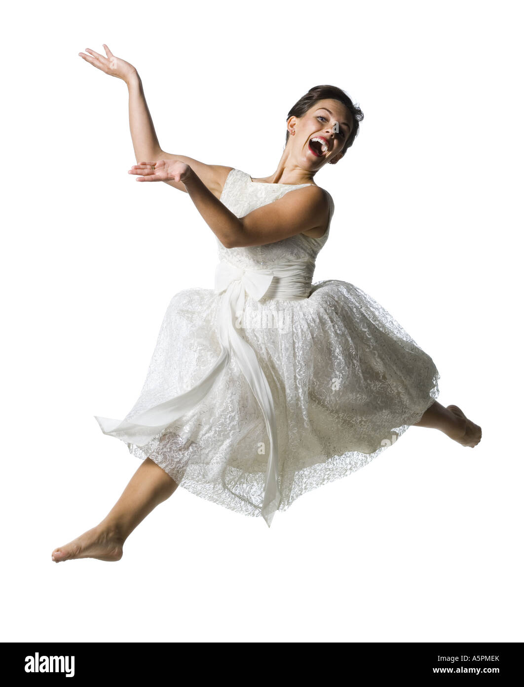 Woman in white dress jumping Stock Photo - Alamy