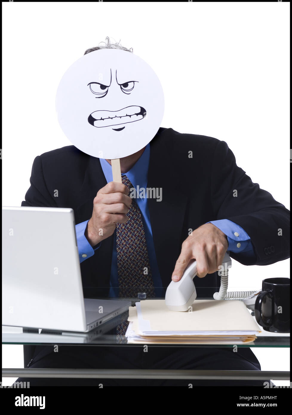 Businessman with Angry face mask taking phone off hook Stock Photo - Alamy