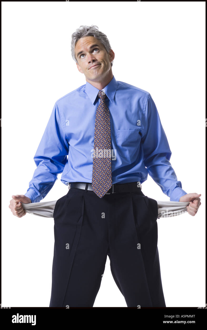 Man with empty pockets inside out Stock Photo - Alamy