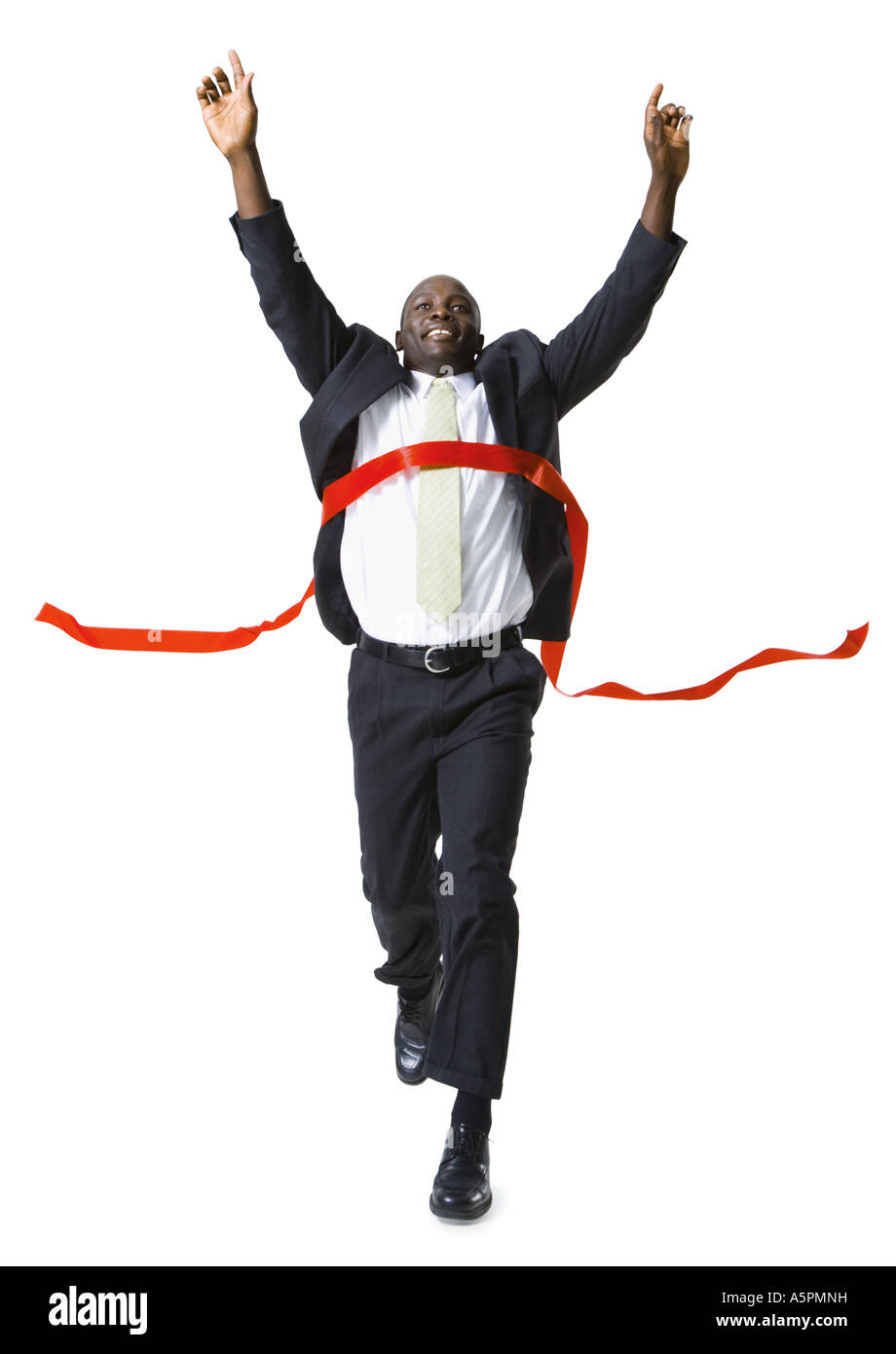 A running businessman takes first place as he crosses the finish line ...