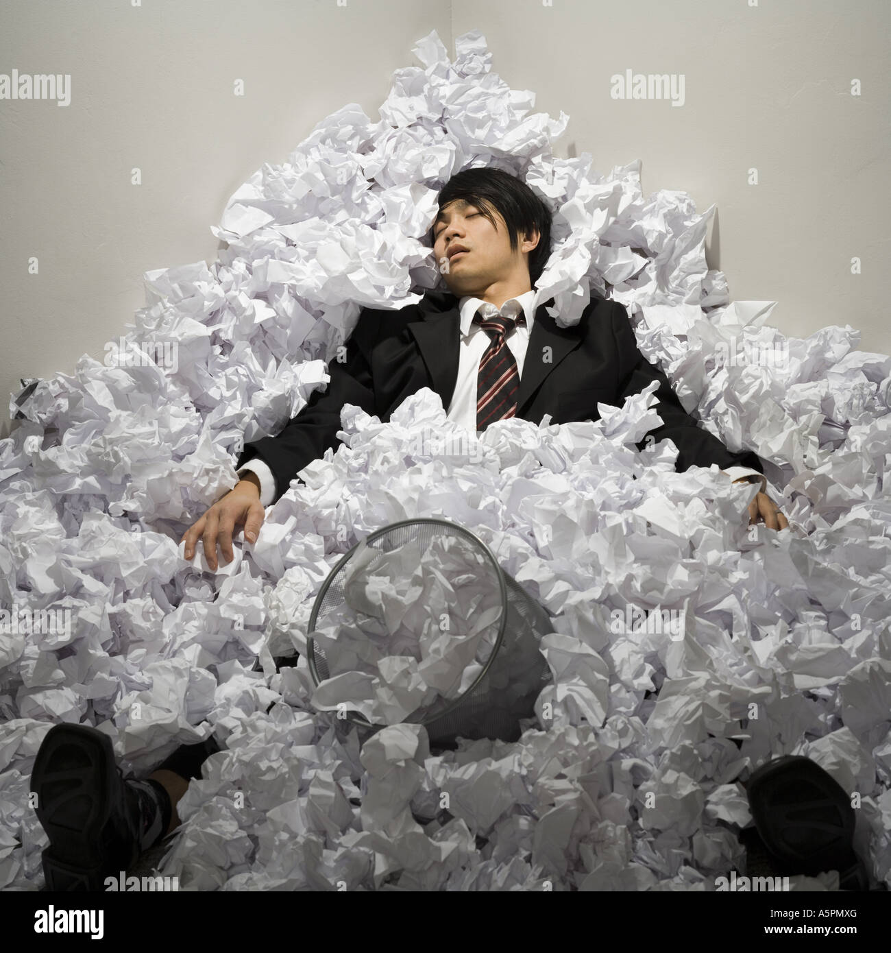 Businessman buried in mountain of crumpled papers Stock Photo - Alamy Businessman buried in mountain of crumpled papers Stock Photo - Alamy