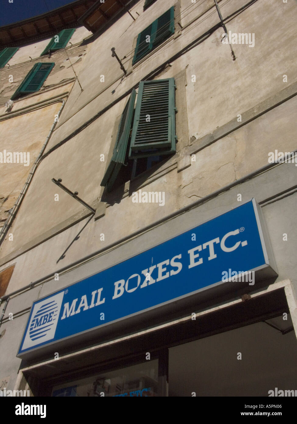 A multinational company logo contrast with local building facades Stock ...