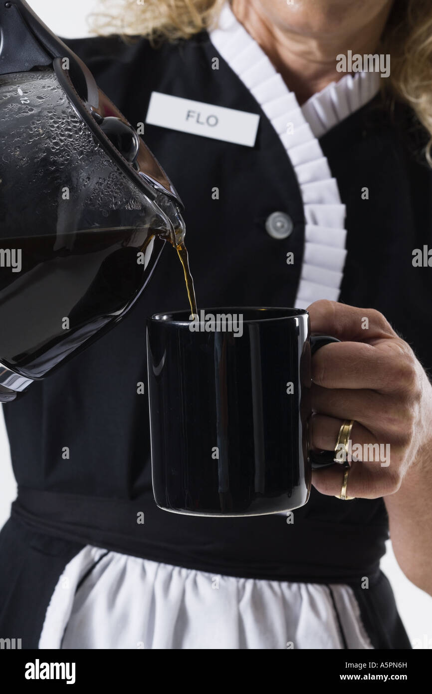 Waitress serving coffee Stock Photo - Alamy